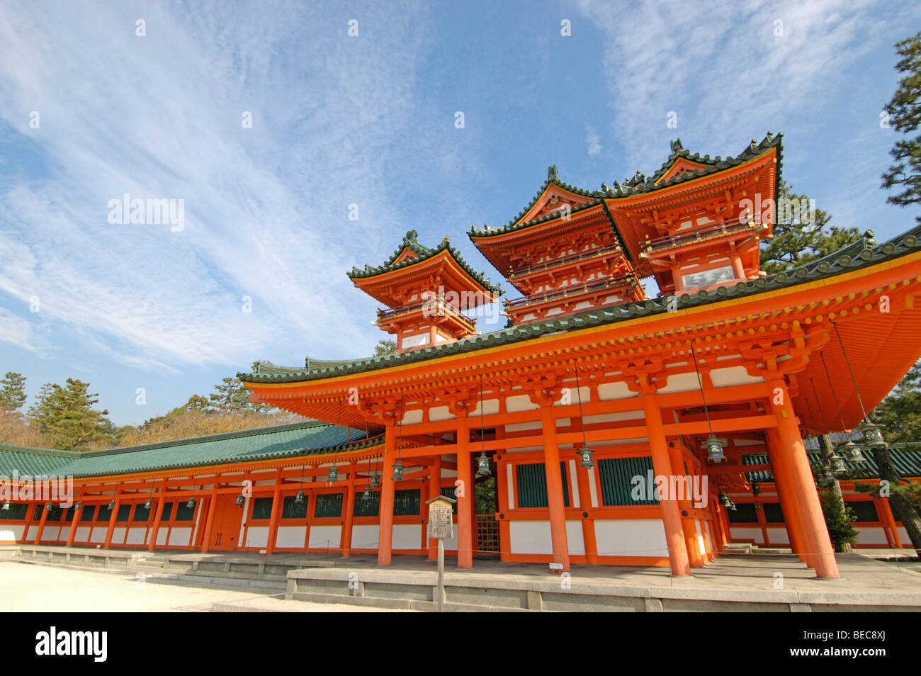 Vermilion building with blue skies and wispy cloud at Heian Jingu ...