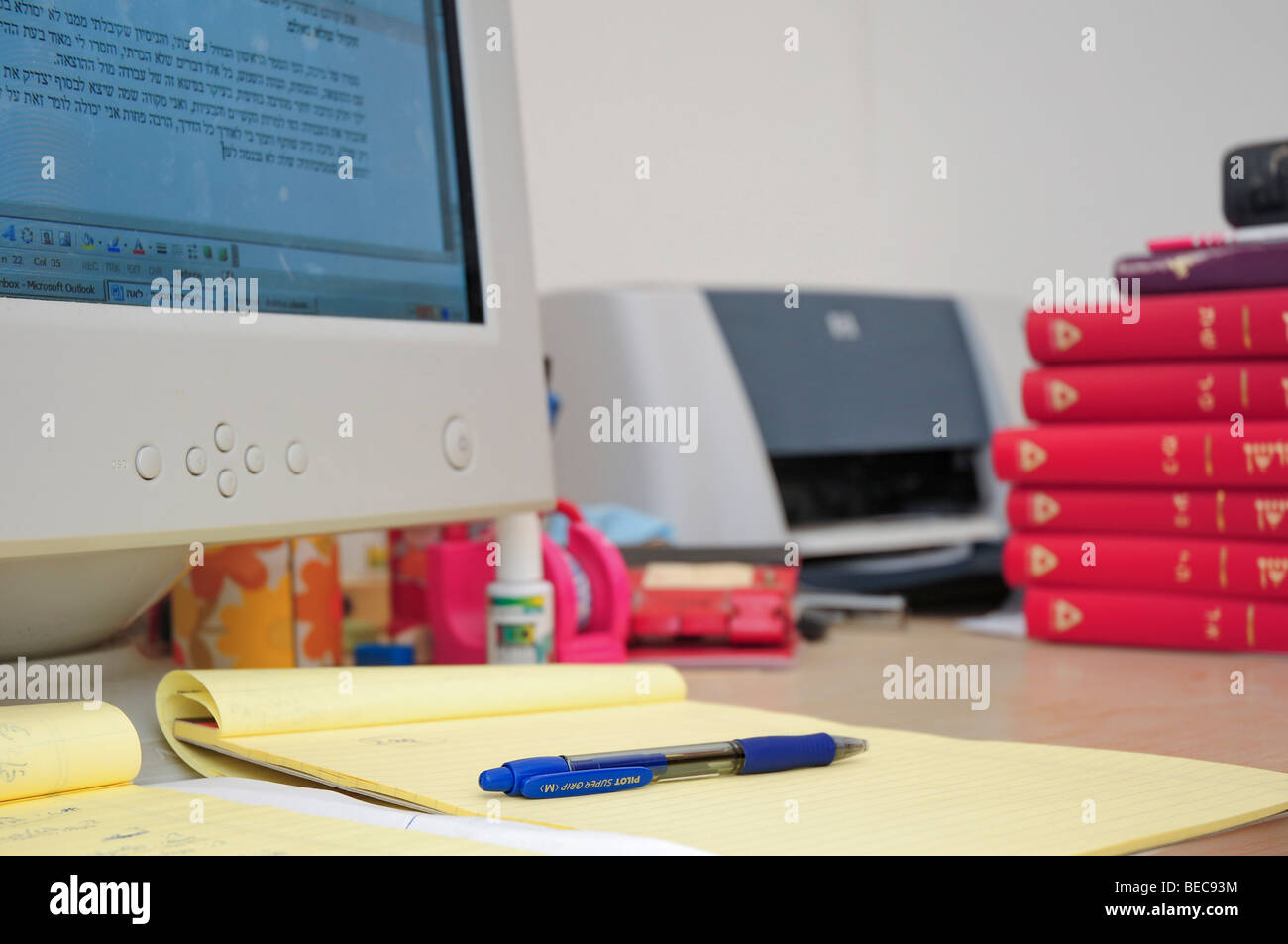 Copy-Editor work station with computer, dictionary and other textbooks ...