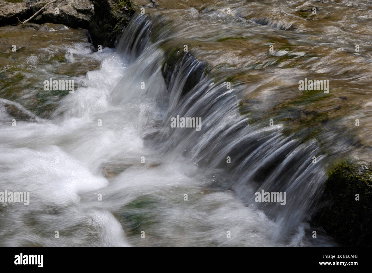 Small waterfall, running water, close-up Stock Photo - Alamy