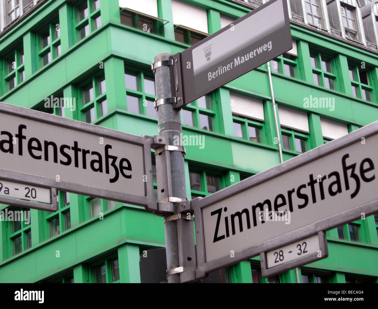 Street signs and a marker indicating the former location of the Berlin ...