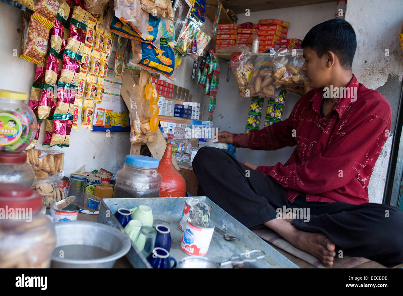Man in small shop in Dhaka Bangladesh Stock Photo - Alamy