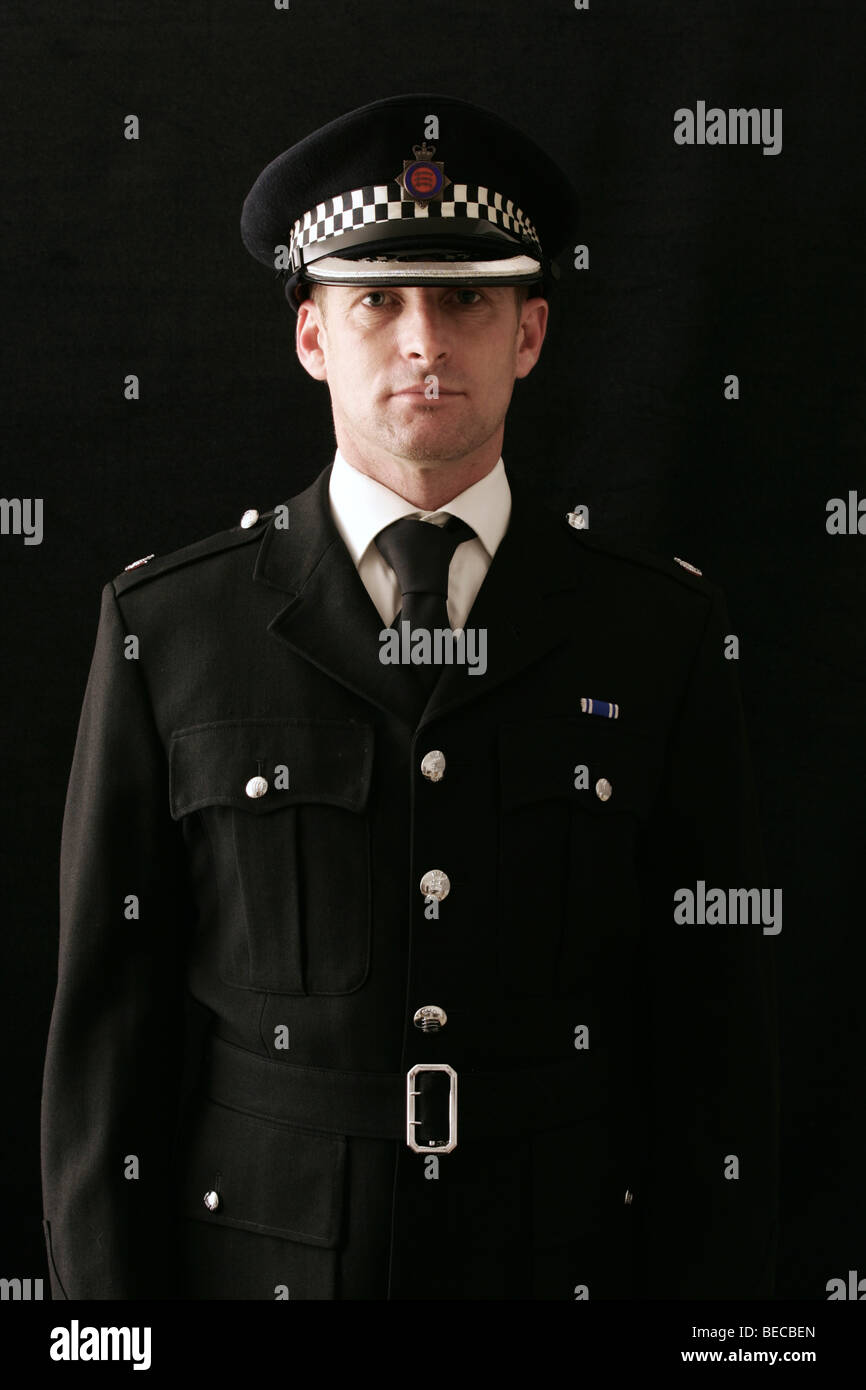 British Policeman on plain background Stock Photo - Alamy