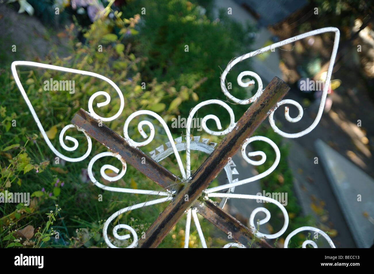 Metal cross in a cemetery Stock Photo - Alamy