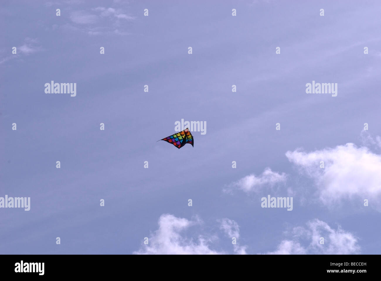 Kites flying against a blue sky Stock Photo - Alamy