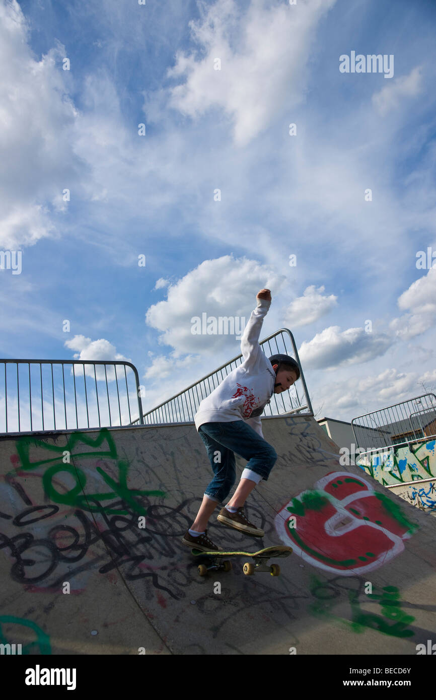 A boy practicing skateboarding in a skatepark Stock Photo - Alamy