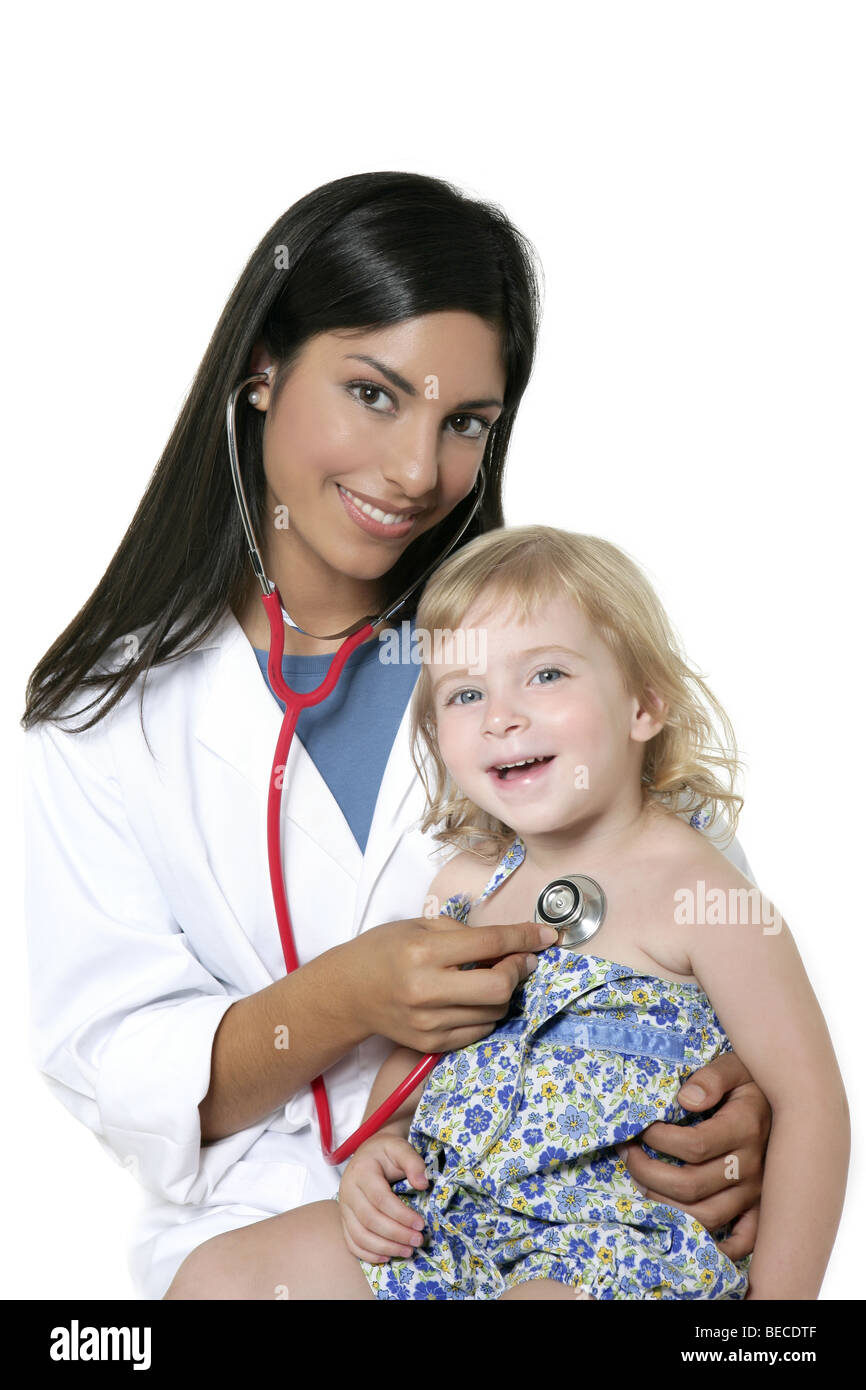 Brunette pediatric doctor with blond little girl on medical exam Stock ...