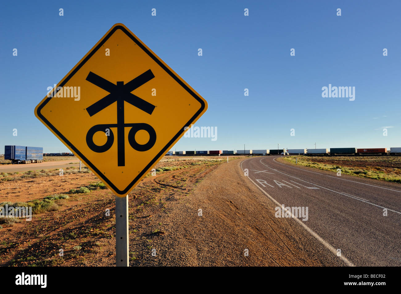 A railway crossing in Outback Australia. The goods trains are very long ...