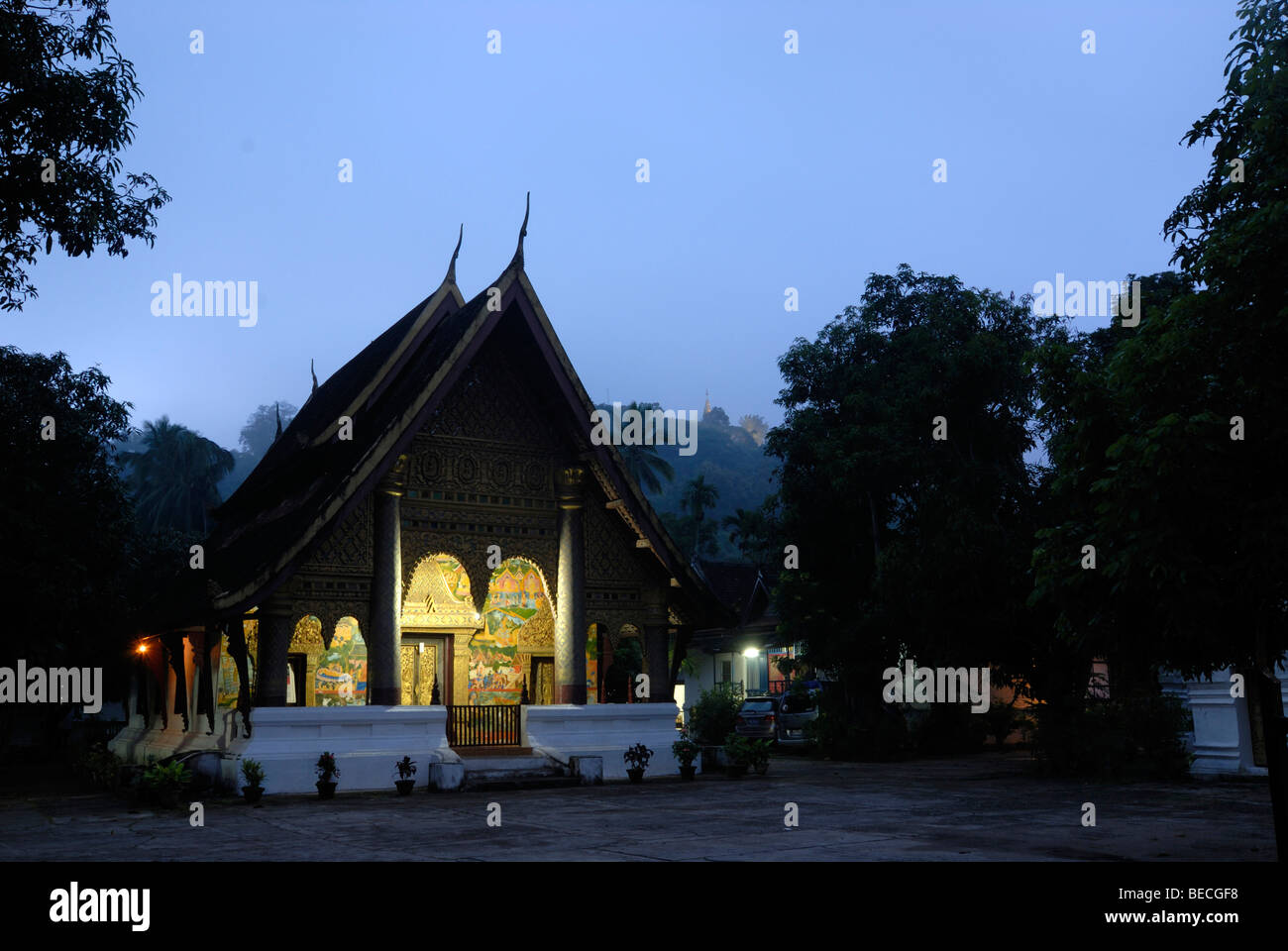 Dawn in Vat Xieng Mouane monastery in front of Mount Phousi, Luang ...