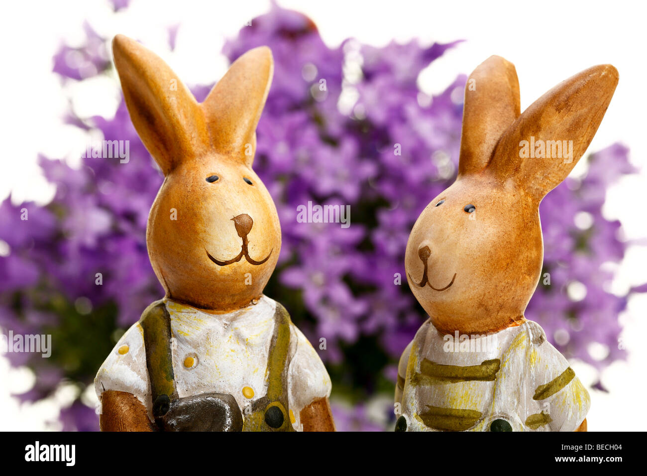 Two Easter bunnies in front of bellflowers Stock Photo - Alamy