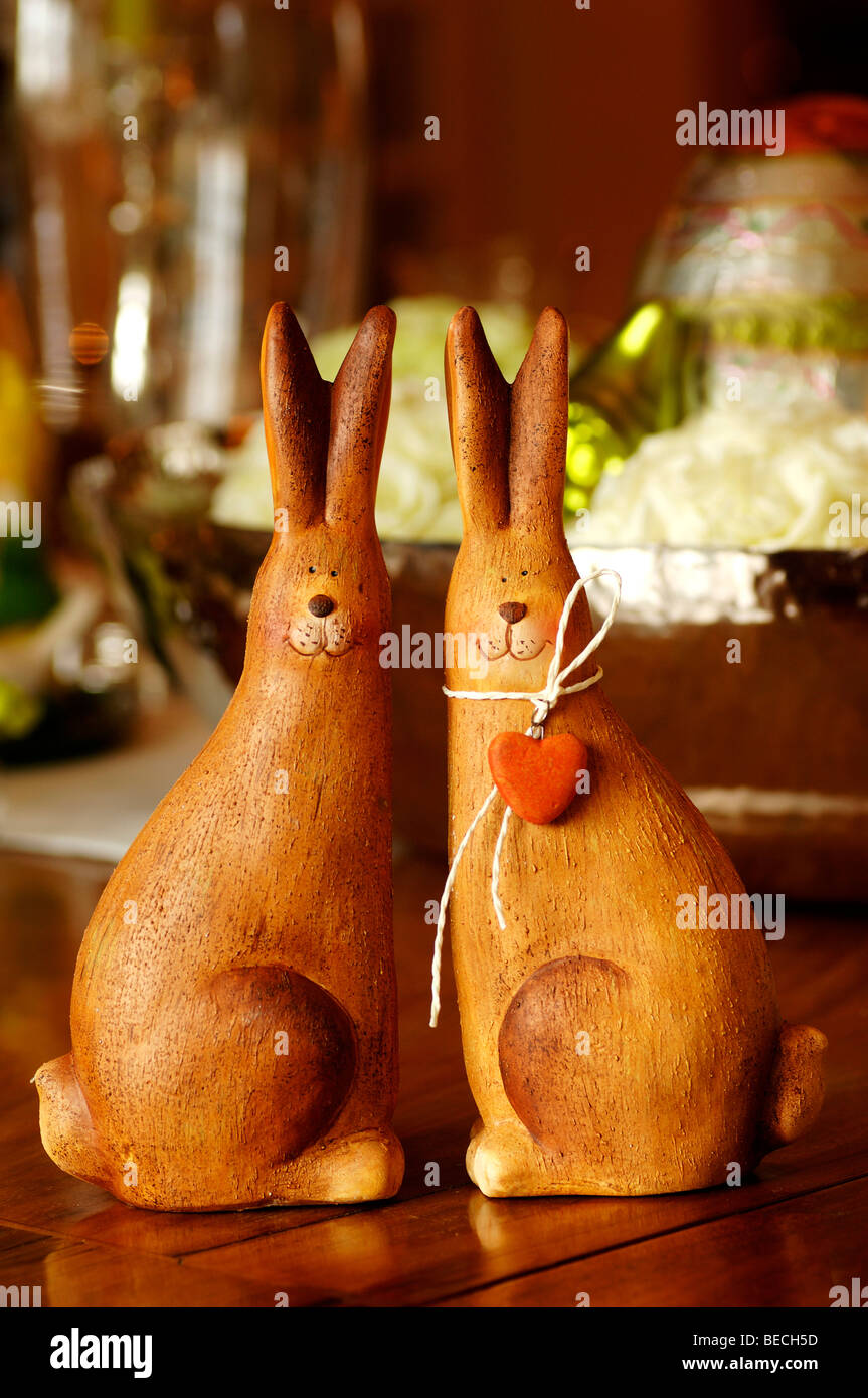 Easter decoration, two clay Easter bunnies on an Easter table Stock ...