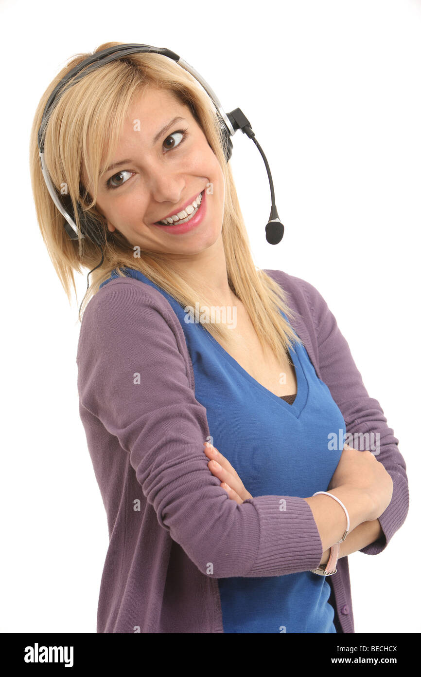 A smiling blonde girl answering with a headset Stock Photo - Alamy