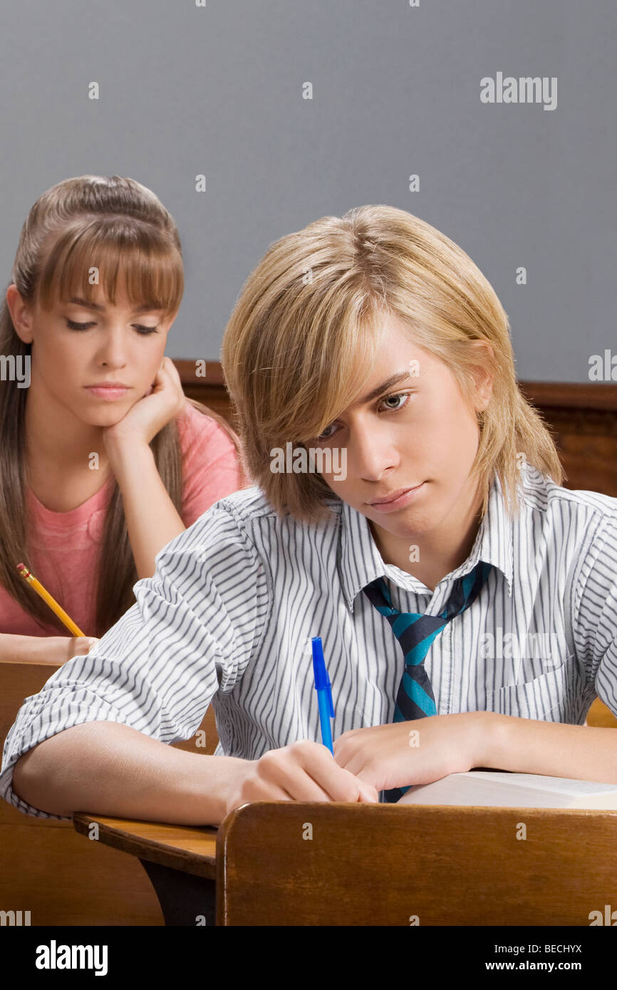 Students giving exam in a classroom Stock Photo - Alamy
