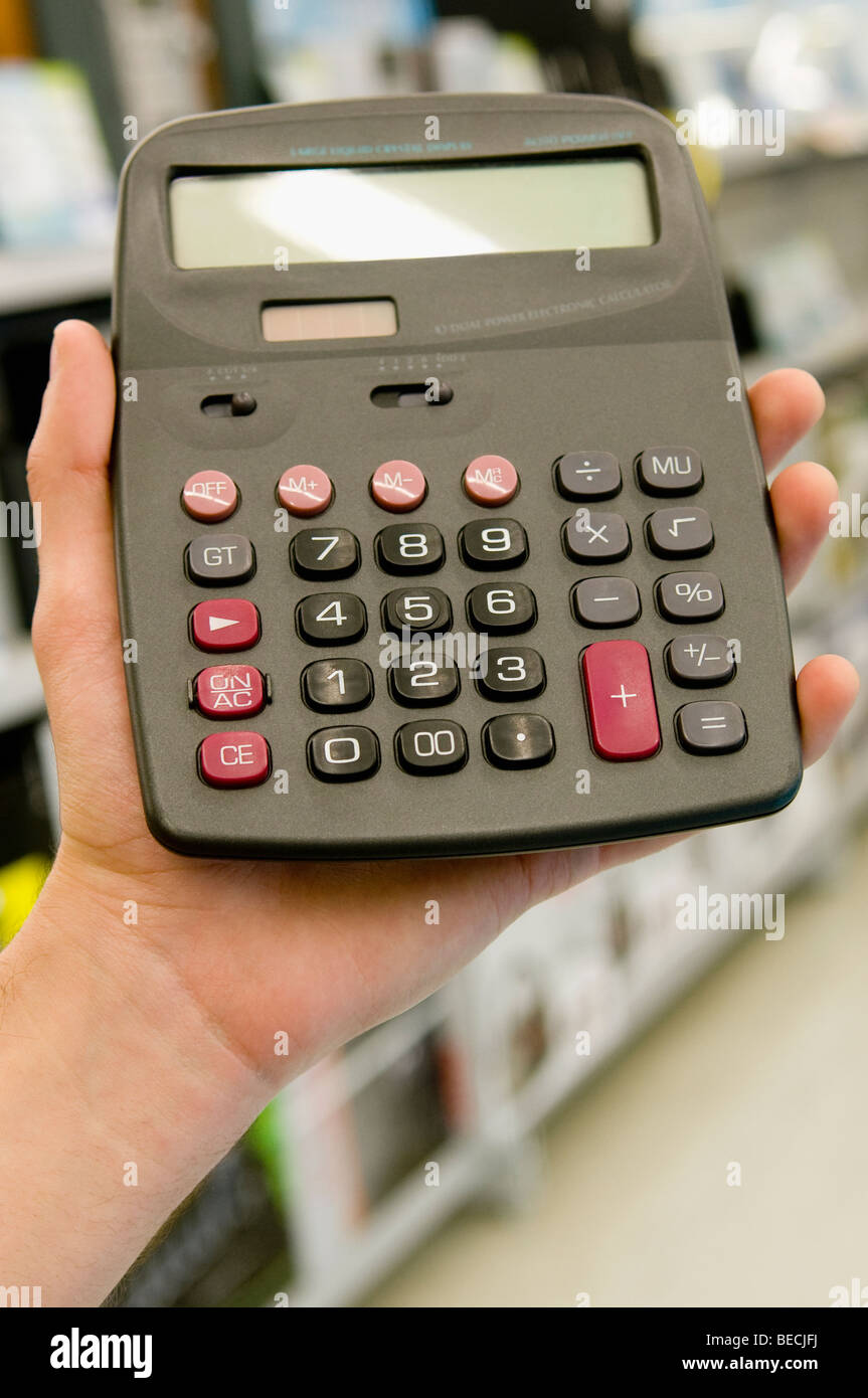 Hand holding calculator hi-res stock photography and images - Alamy