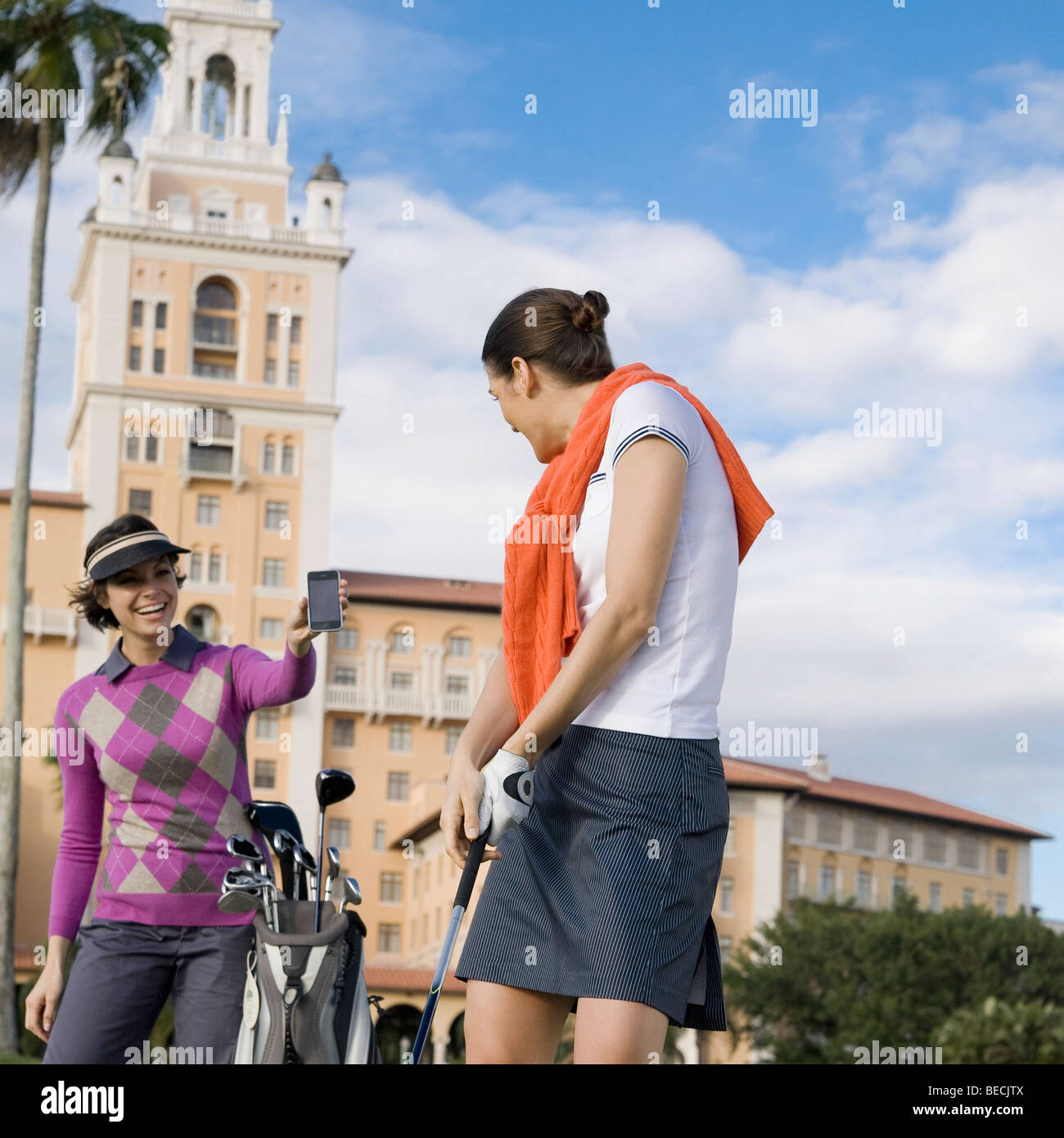 Professional sportsperson smiling looking away holding showing standing ...