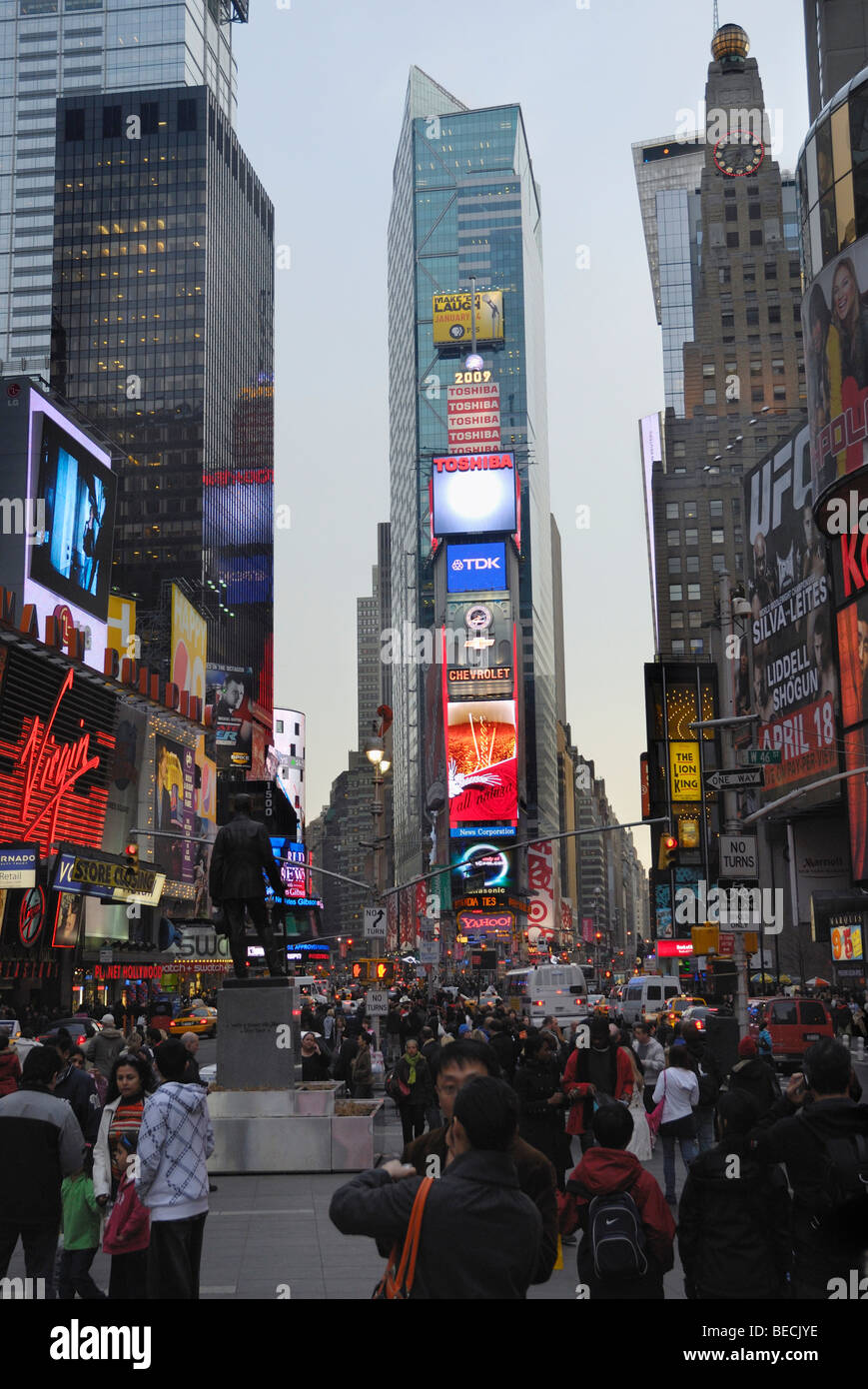 Tourists and neon advertising signs on Time Square, New York, USA Stock ...
