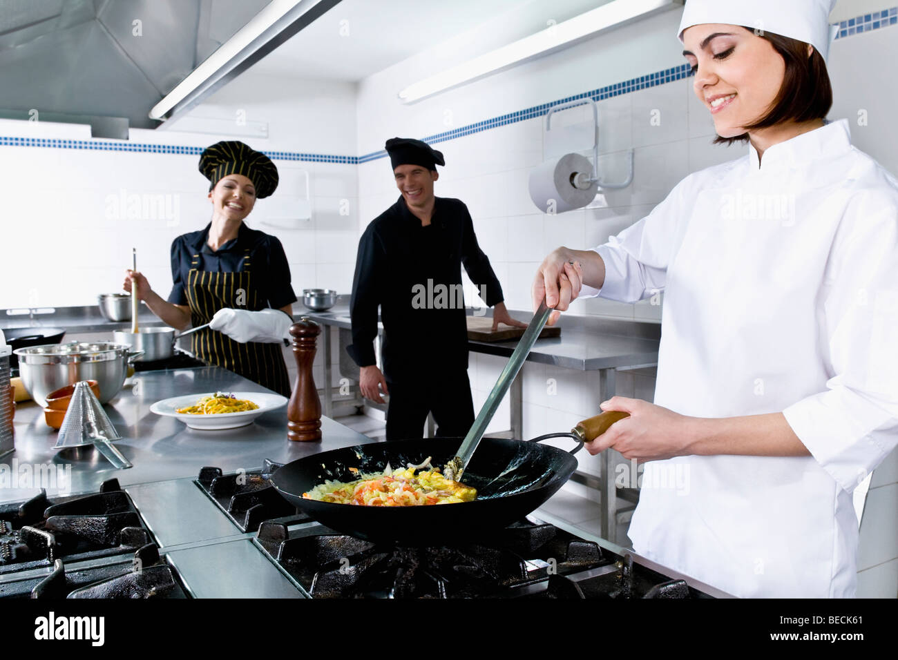 Chefs cooking food in the kitchen Stock Photo - Alamy