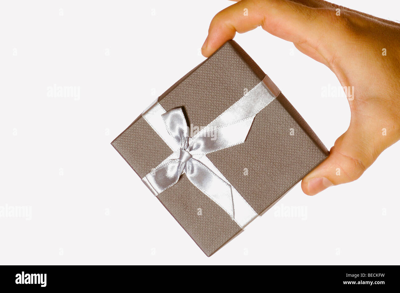 Close-up of a human hand holding a gift Stock Photo - Alamy