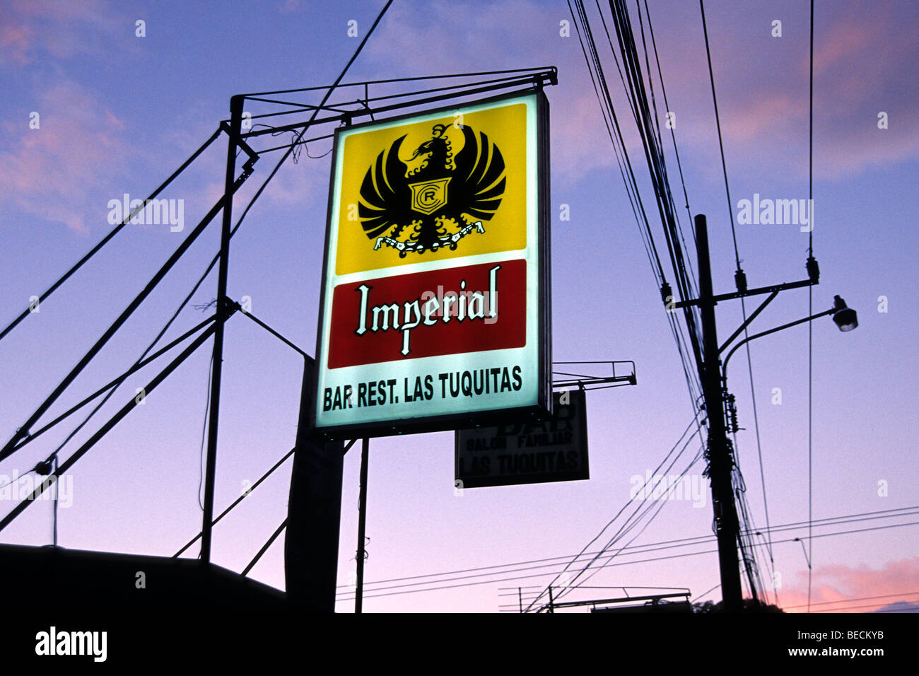Evening mood with power lines and neon lights, sign for the Imperial ...