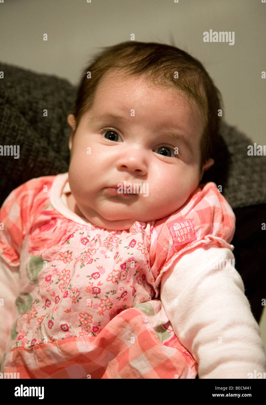 Baby in pink clothing Stock Photo - Alamy