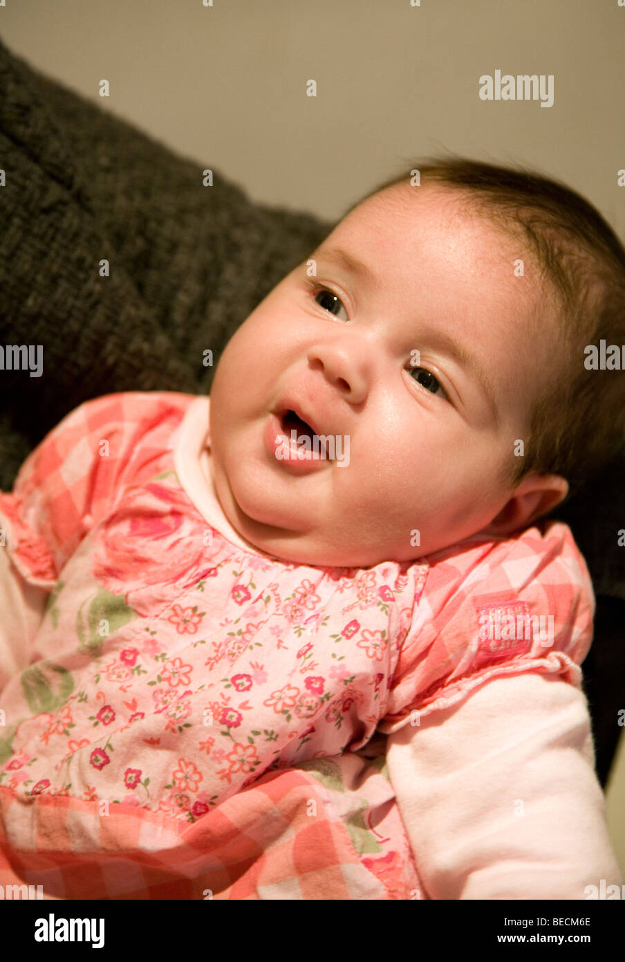 Baby in pink/red outfit Stock Photo - Alamy