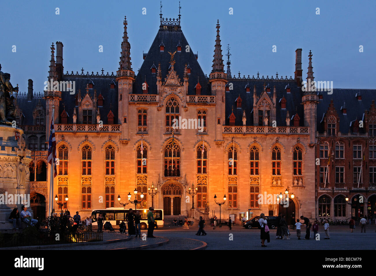 Neo-gothic post office illuminated in the evening, Market Square ...