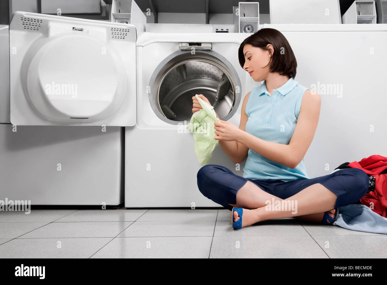Woman doing laundry Stock Photo - Alamy
