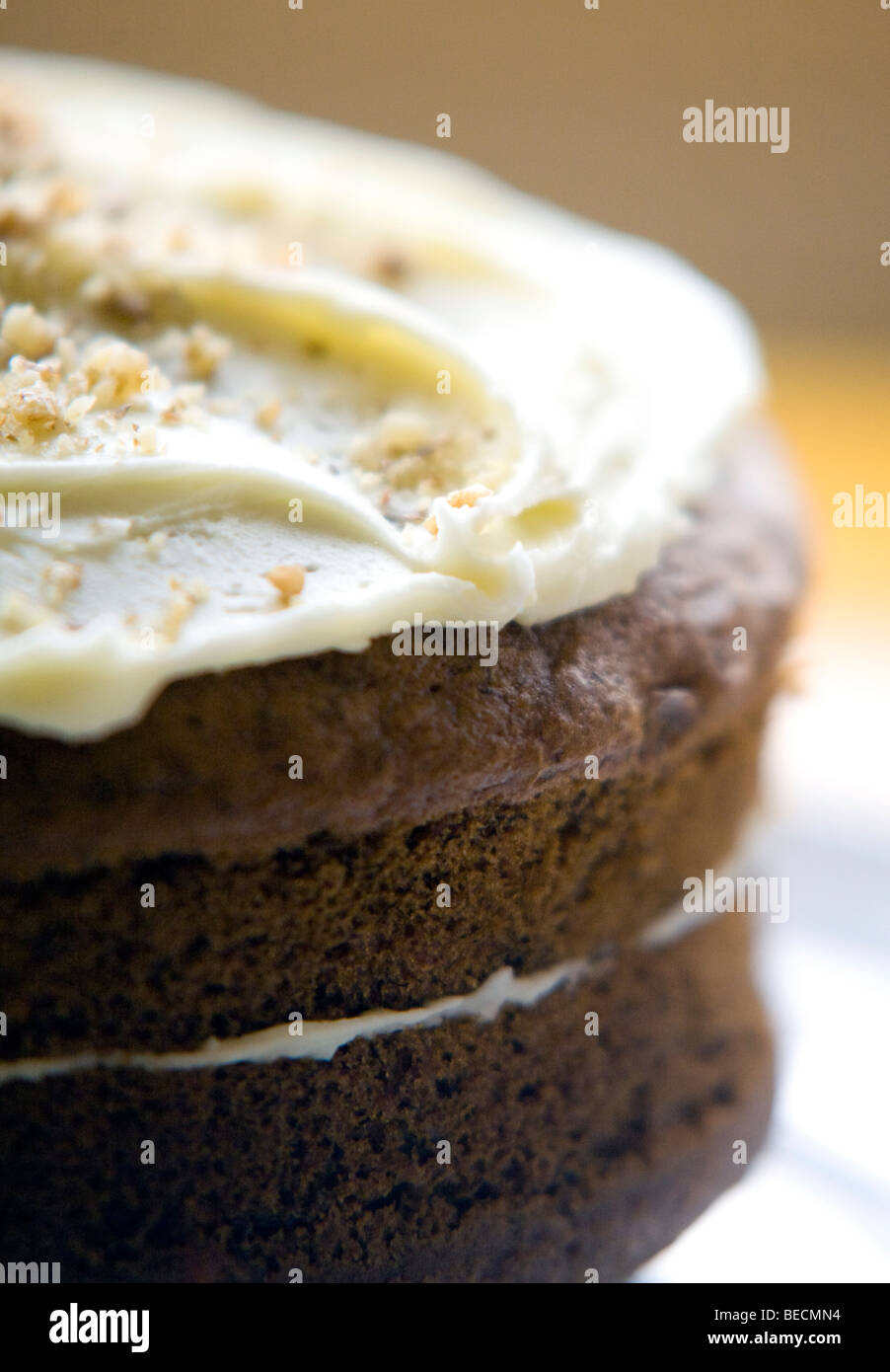 Sponge cake and icing on a cake stand Stock Photo - Alamy