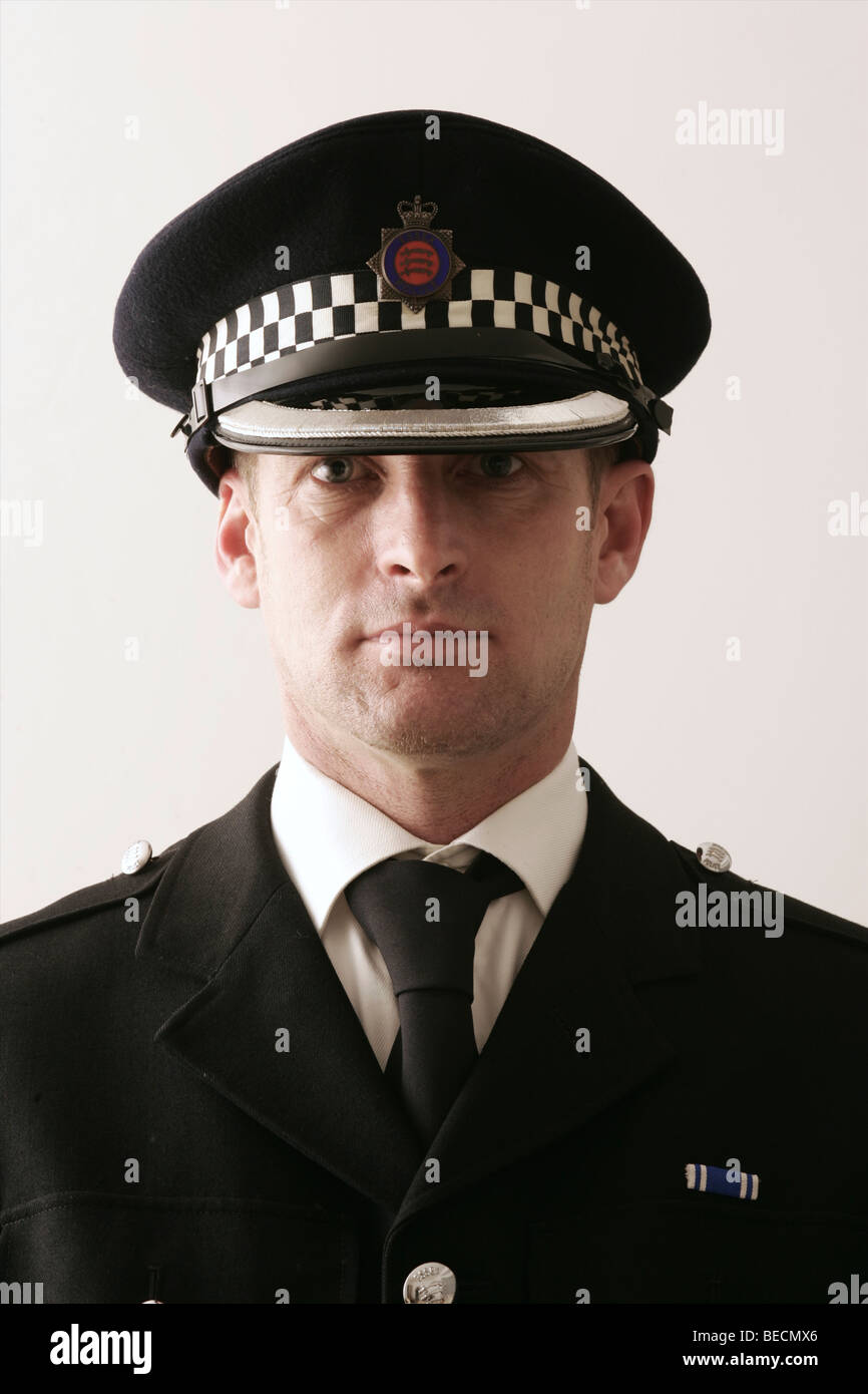 British Policeman on plain background Stock Photo - Alamy