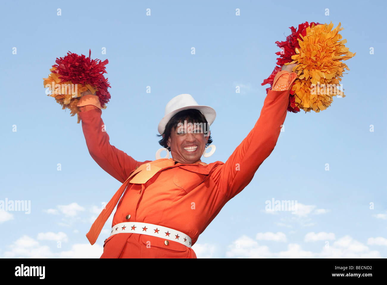 Low angle view of a gay man holding pom-poms, DuPont Circle, Washington ...