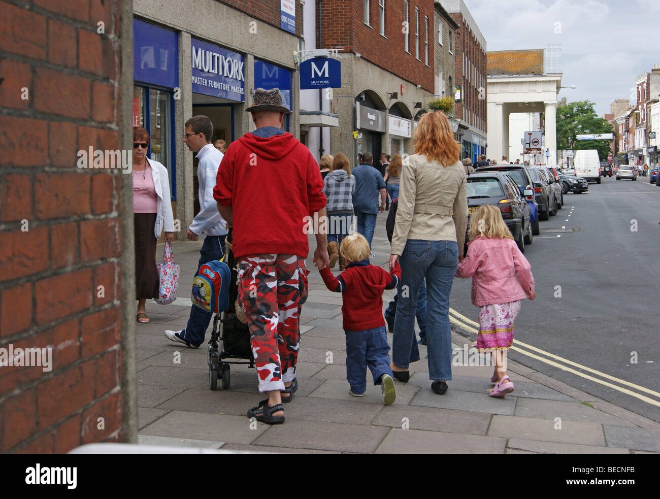 family out shopping in Chichester city centre West Sussex Stock Photo ...