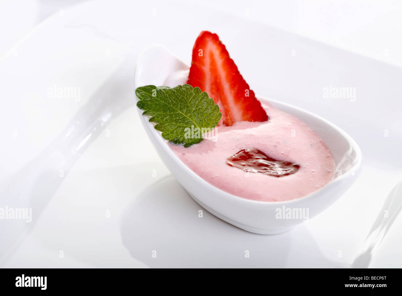 Strawberry quark, yoghurt with fresh strawberries and mint Stock Photo ...