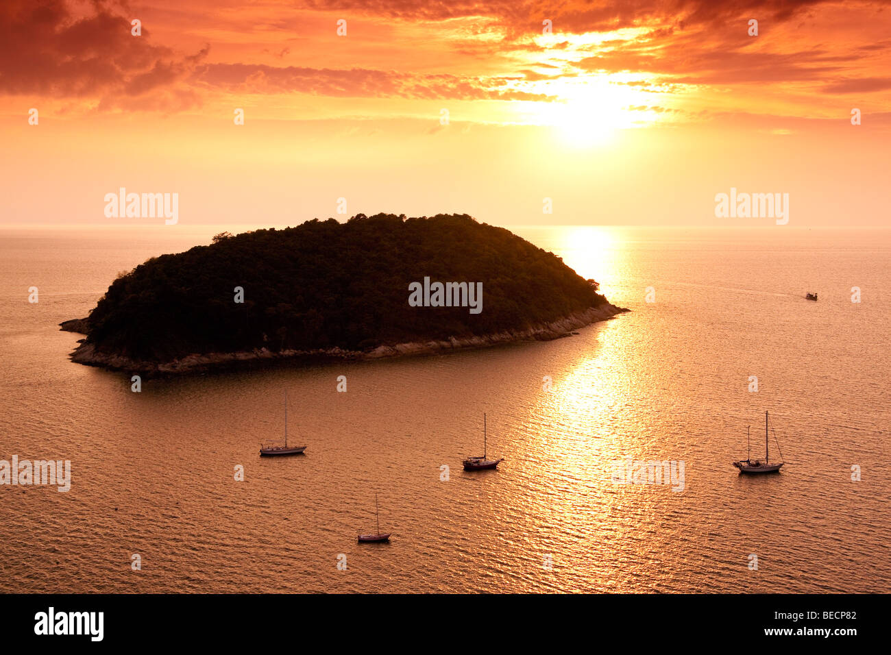 View of the off-shore Ko Man Island shortly before sunset Phuket Island ...