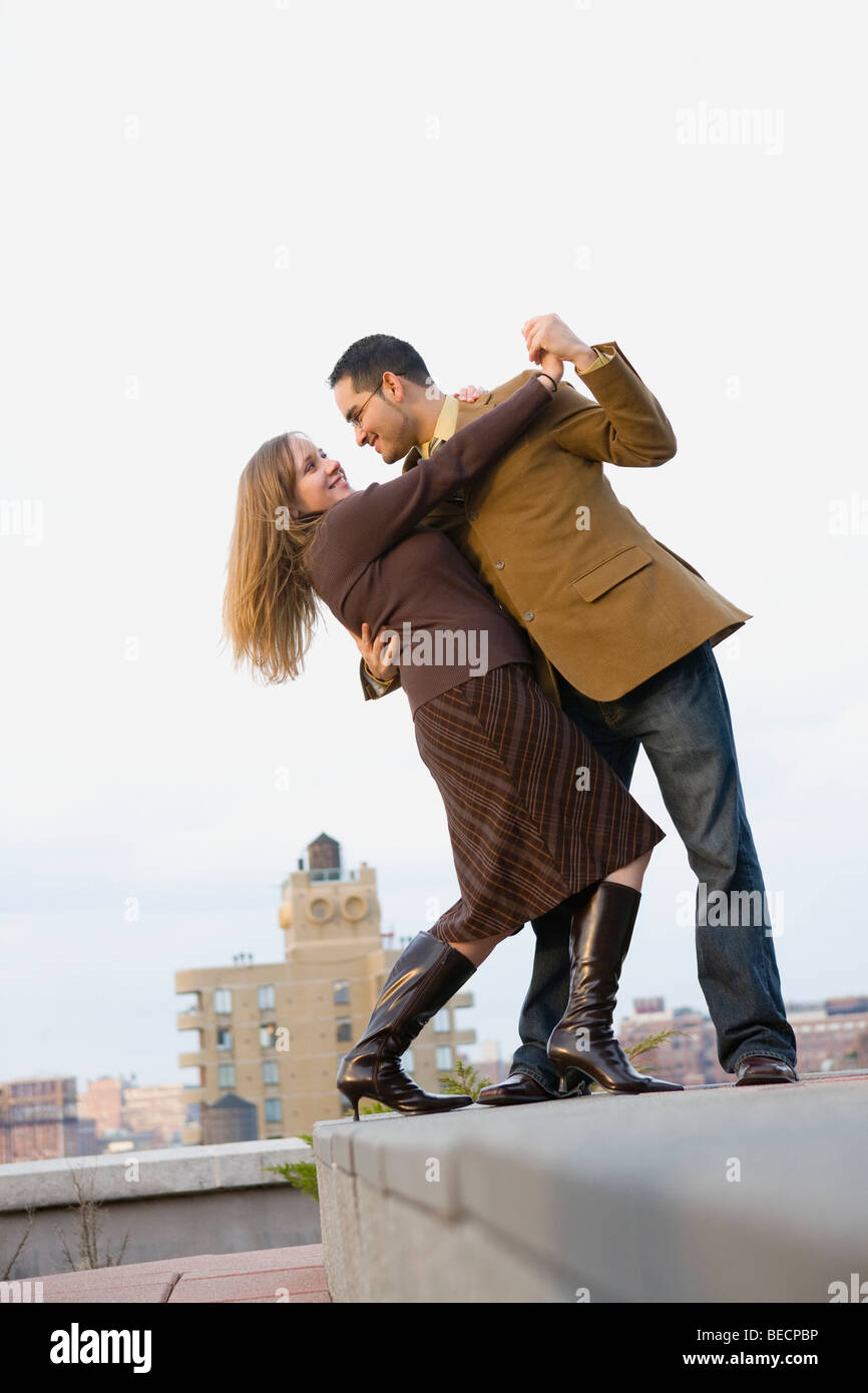 Couple dancing on rooftop Stock Photo - Alamy