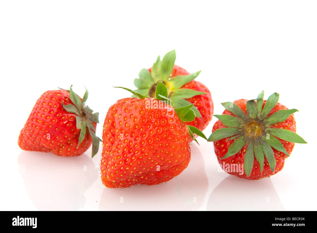 Several fresh sweet strawberries isolated over white Stock Photo - Alamy