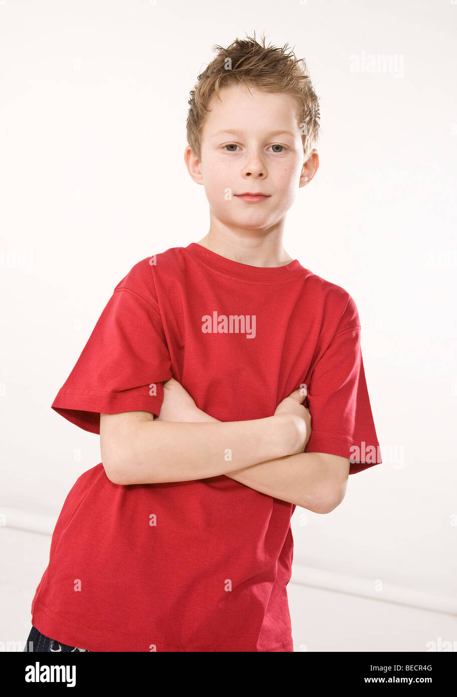 Portrait of a boy with arms crossed Stock Photo - Alamy