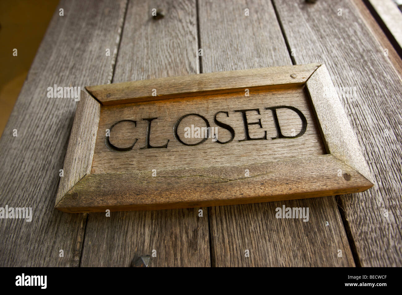 Closed sign on a large wooden medieval door Stock Photo - Alamy