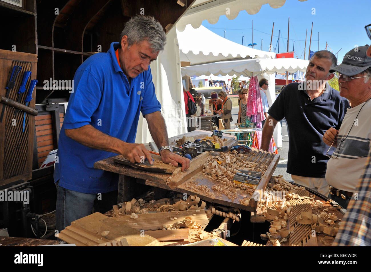 Wood craftsman displaying his tools and craft at the Grand Pavois ...