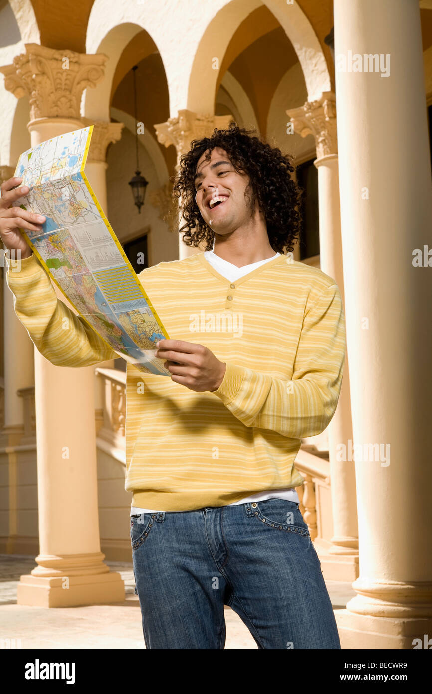 Man reading a map and smiling, Biltmore Hotel, Coral Gables, Florida ...