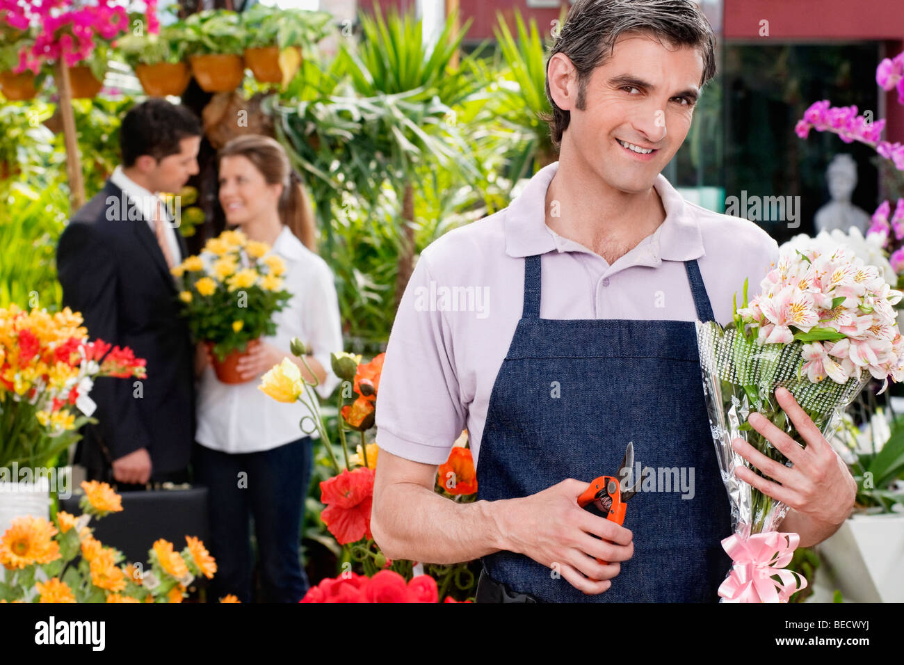 Young couple choosing flowers hi-res stock photography and images - Alamy