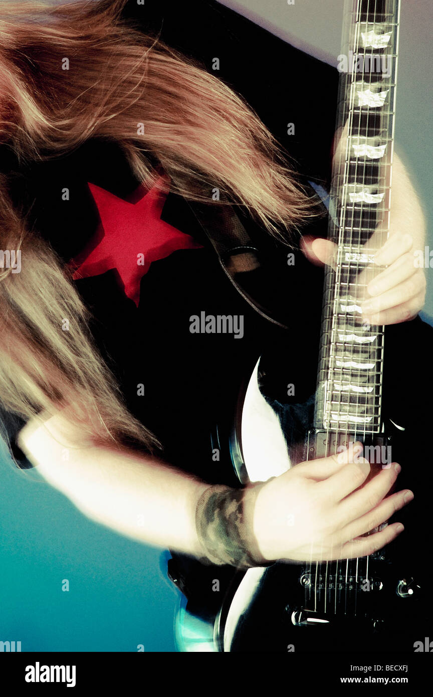 Mid section view of a person playing a guitar Stock Photo - Alamy