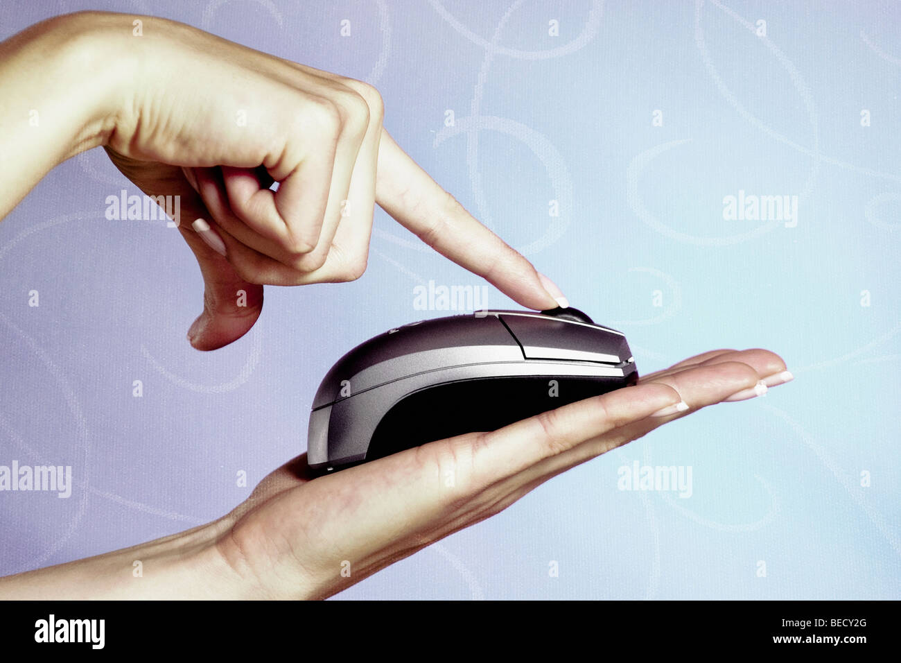 Close-up of a woman's hand using a computer mouse Stock Photo - Alamy