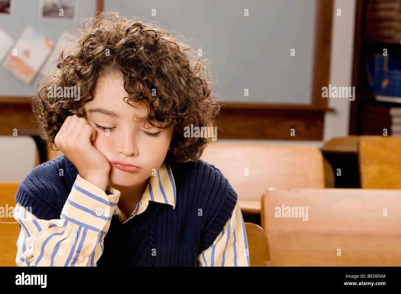 Sad schoolboy sitting in a classroom Stock Photo - Alamy Sad schoolboy sitting in a classroom Stock Photo - Alamy