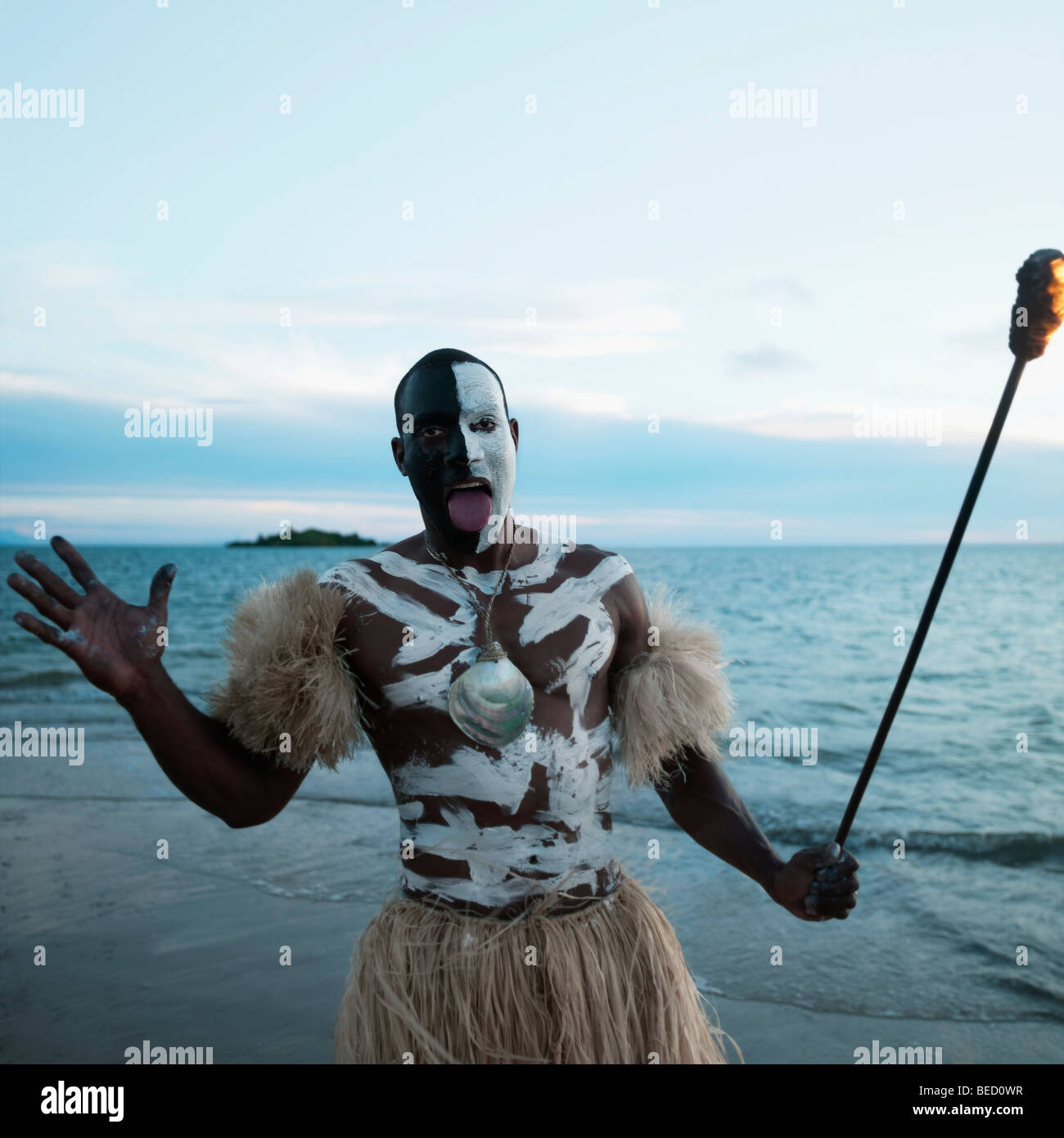 Tribesman looking angry on the beach Stock Photo - Alamy