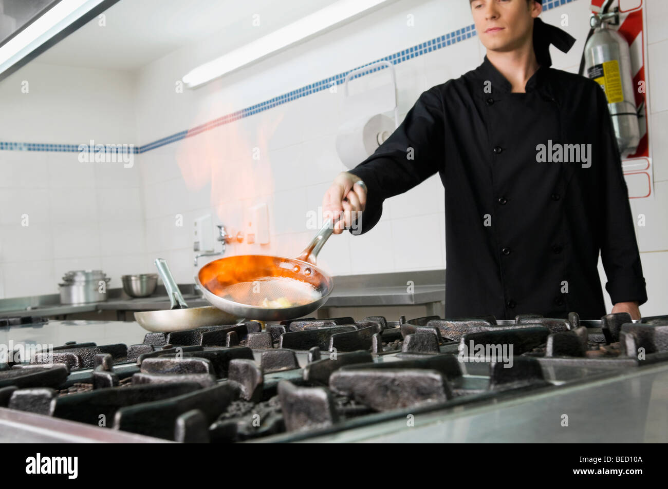 Chef cooking food Stock Photo - Alamy