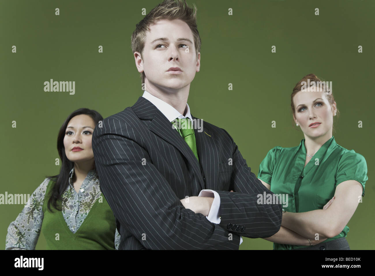 Three business executive posing Stock Photo - Alamy