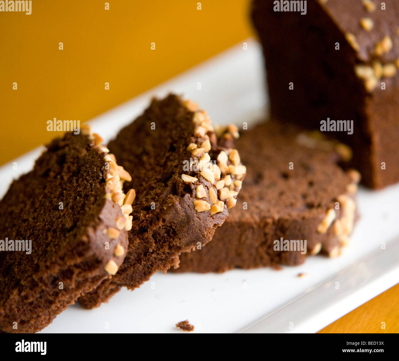 A slice of chocolate loaf cake on a plate Stock Photo - Alamy