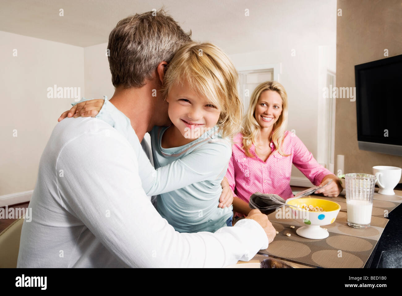 Man hugging his daughter Stock Photo - Alamy
