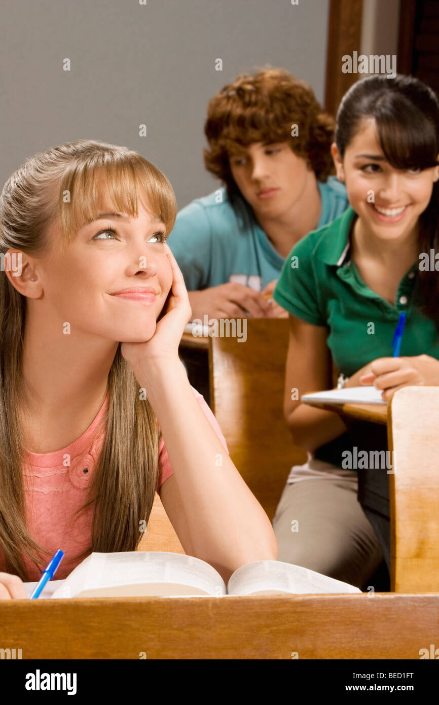 Student day dreaming in a classroom Stock Photo - Alamy