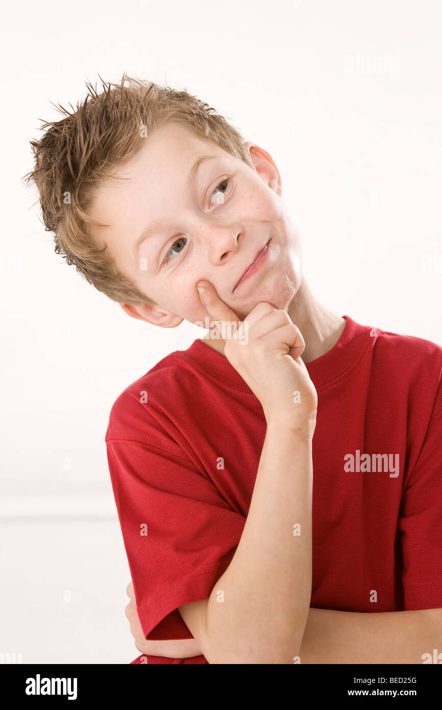 Portrait of a thoughtful looking boy Stock Photo - Alamy