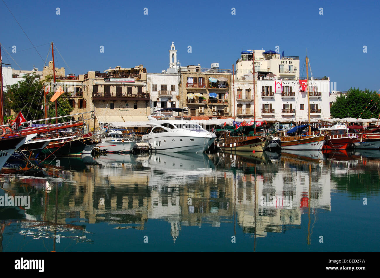 NORTH CYPRUS. Buildings and boats reflected in the harbour at Kyrenia ...
